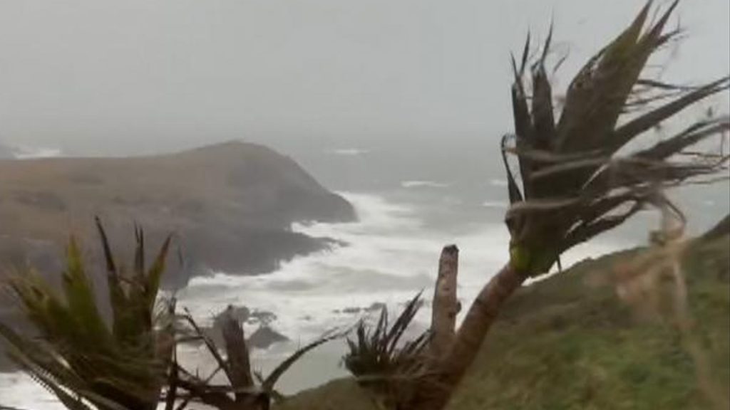 Battered coasts, wobbly planes and closed roads as Storm Dave sweeps ...